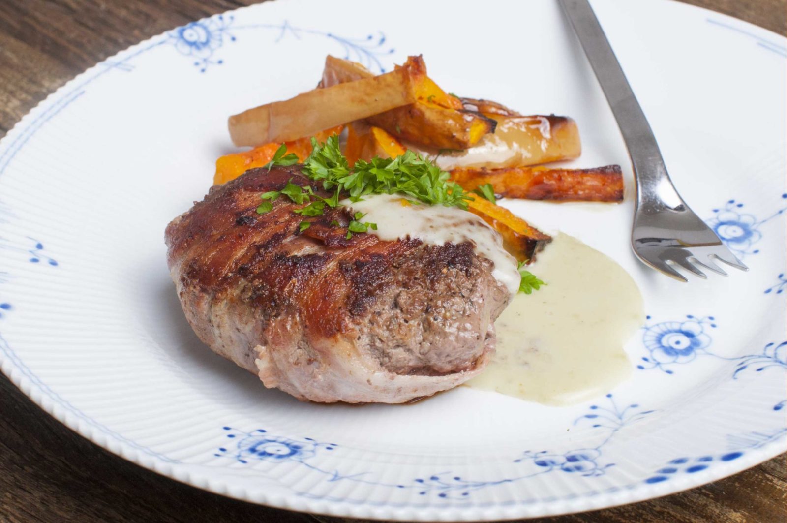 Bacon-wrapped mince steaks with baked hokkaido pumpkin