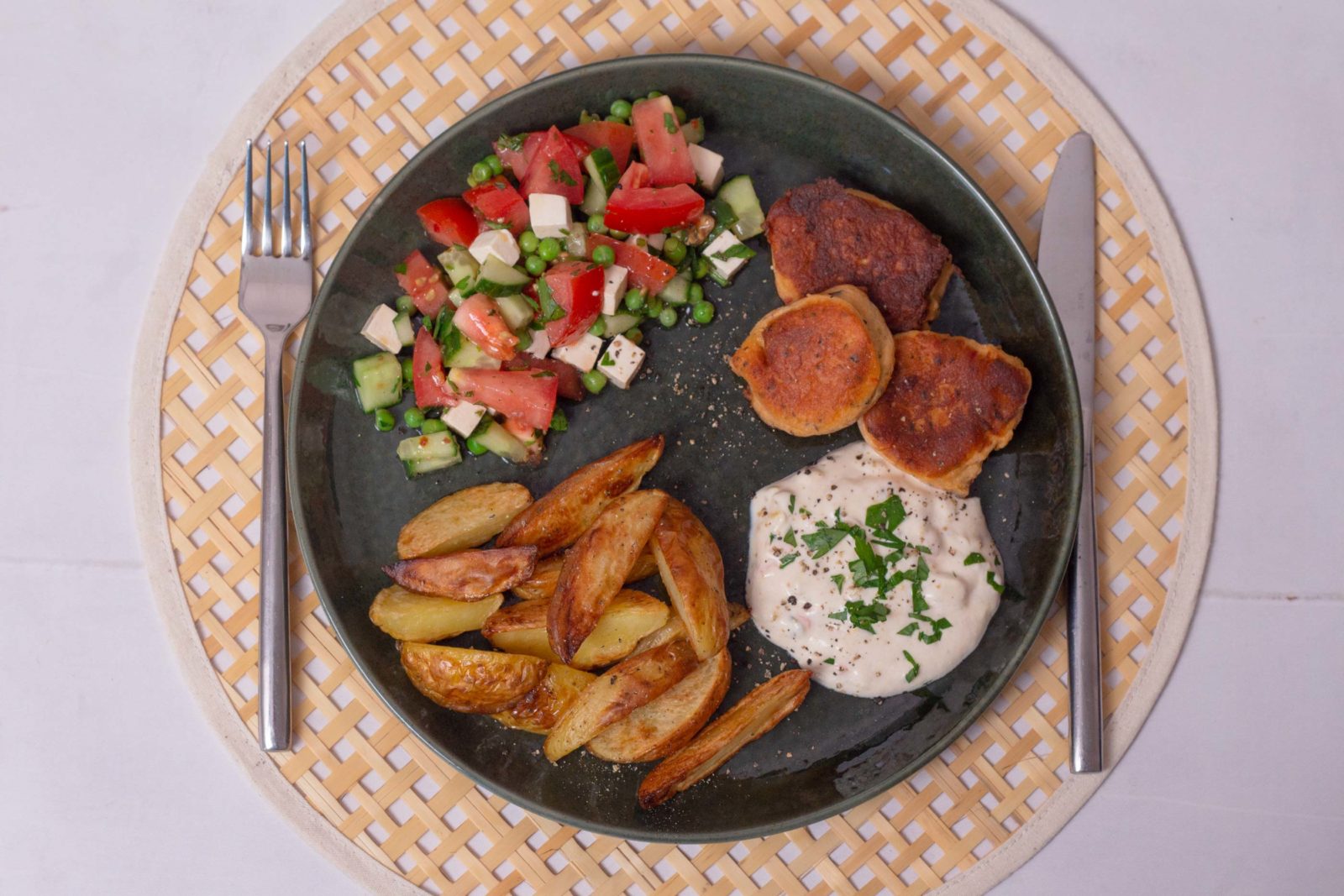 Danish-style fishcakes with potato wedges and salad