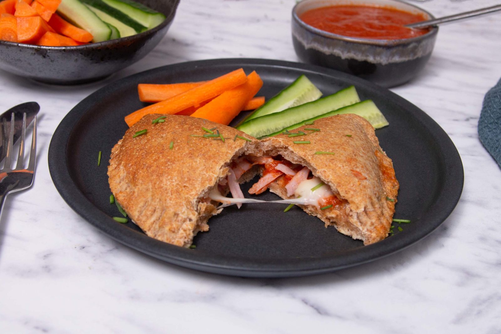 Easy homemade calzones with ham and snack veggies